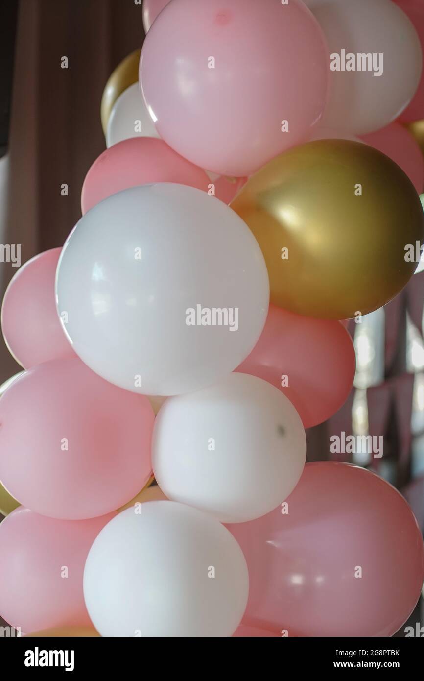 Many colorful balloons decorated wall as background. Beautiful ...