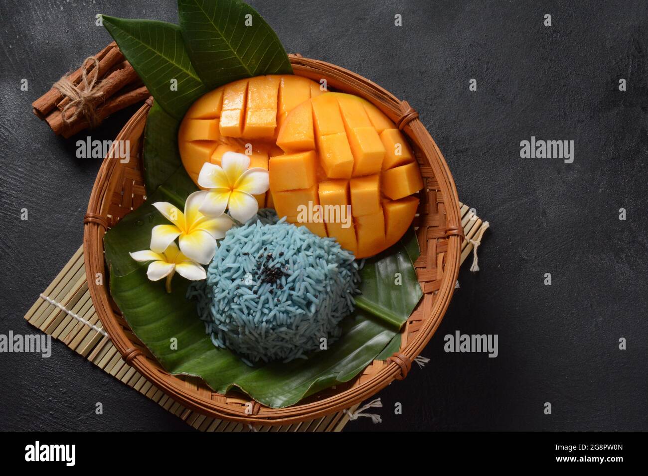 Mango and sticky rice, Thai sweet dessert, colored with butterfly pea ...