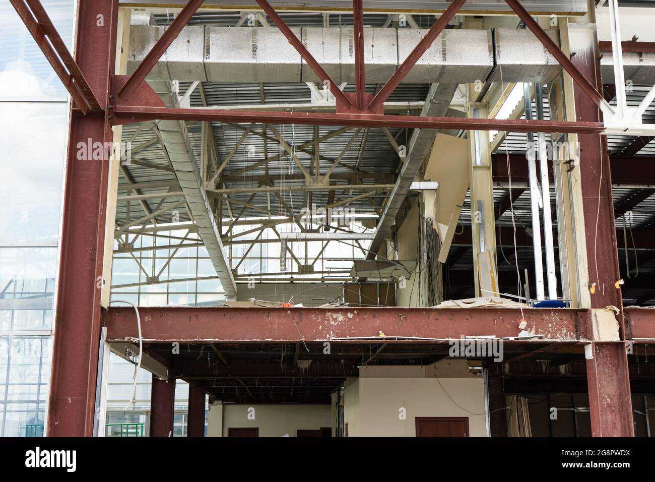 a modern office building destroyed by a disaster. building frame ...