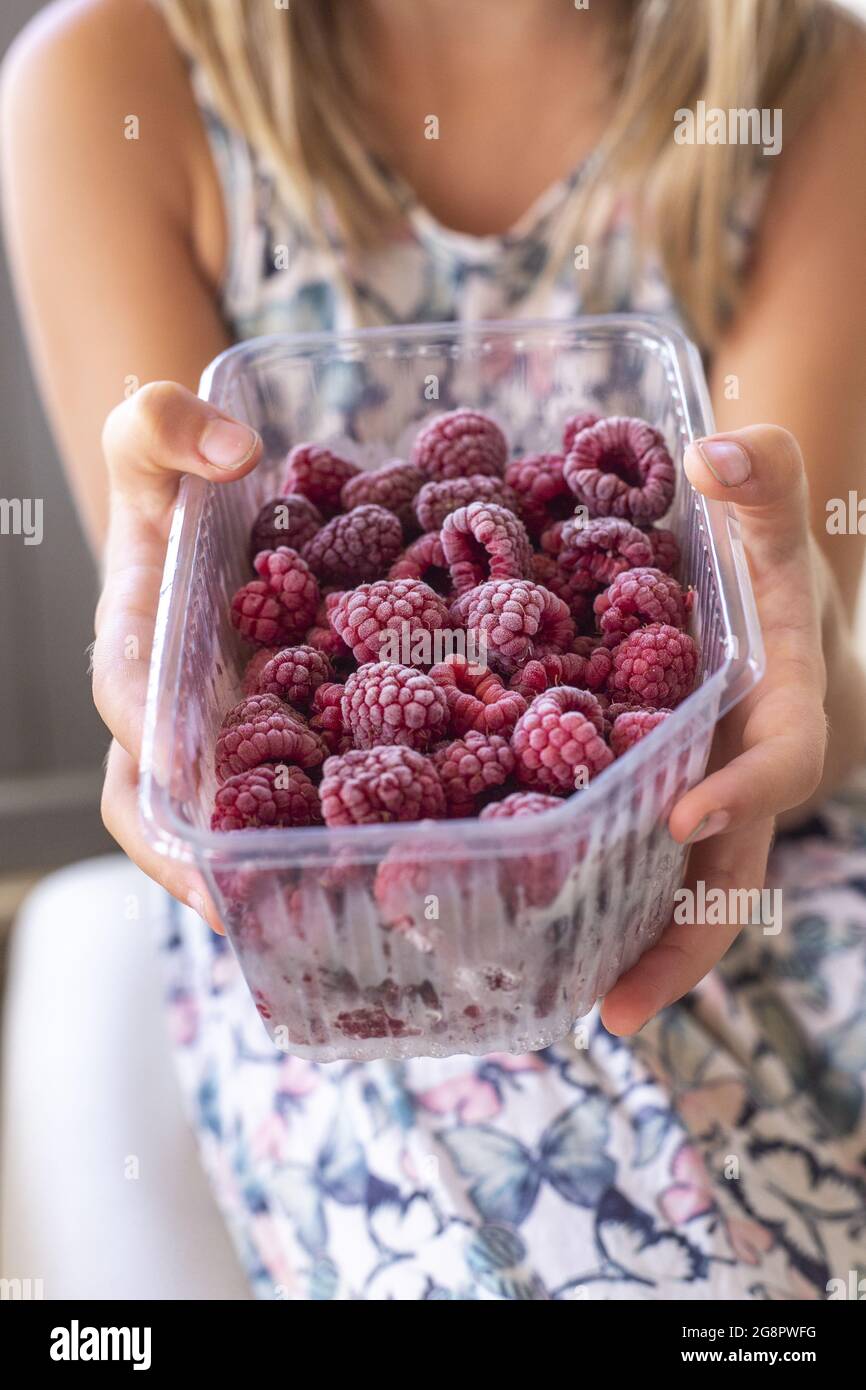 Frozen raspberries in clear hi-res stock photography and images - Alamy