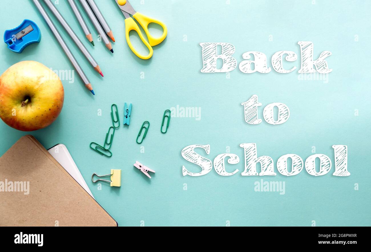 concept back to school creative top view. White chalk letters on paper ...