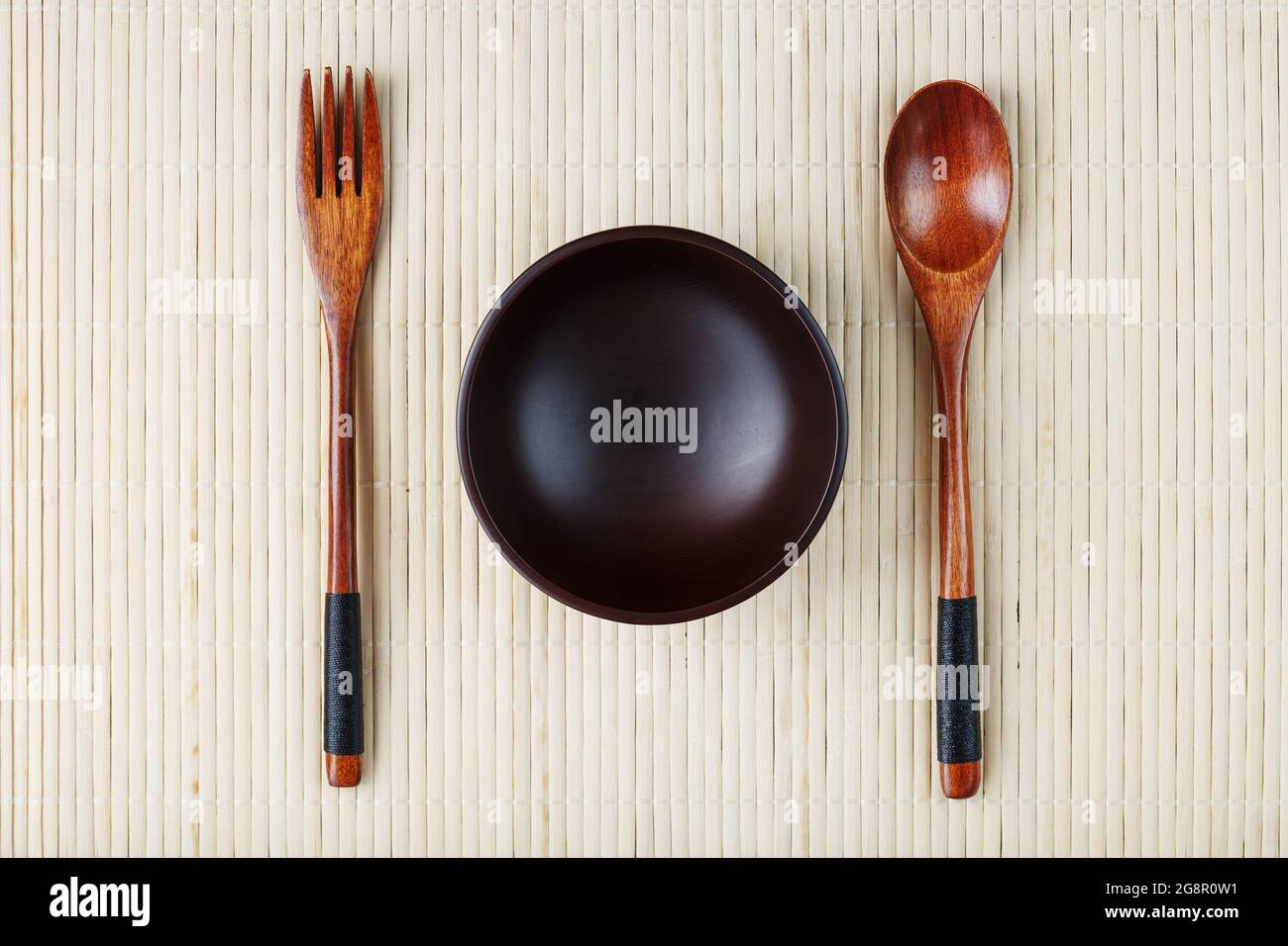 Wooden Spoon, Fork and Plate on a Bamboo Backing. Asian food handicraft ...