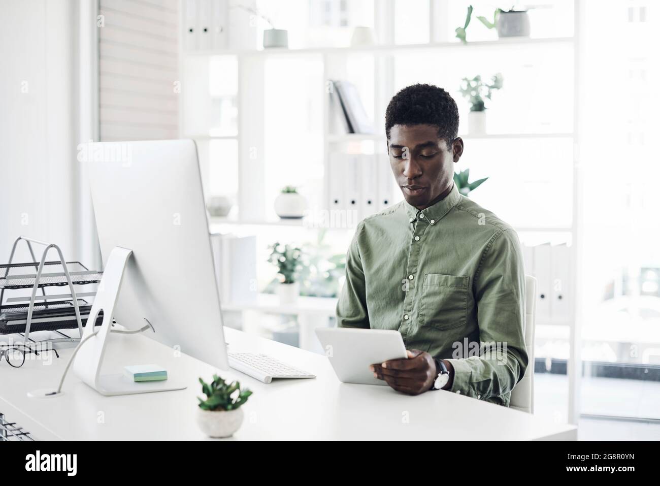 Keeping up to date with it all Stock Photo - Alamy