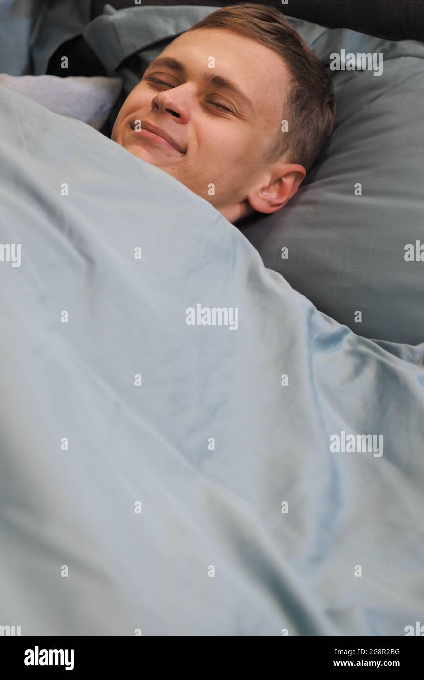 Man under covers hi-res stock photography and images - Alamy