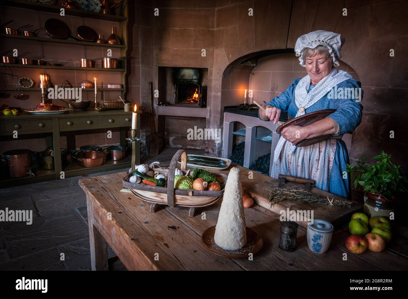 The Georgian kitchen of Paxton House with the Cook hard at work Stock ...