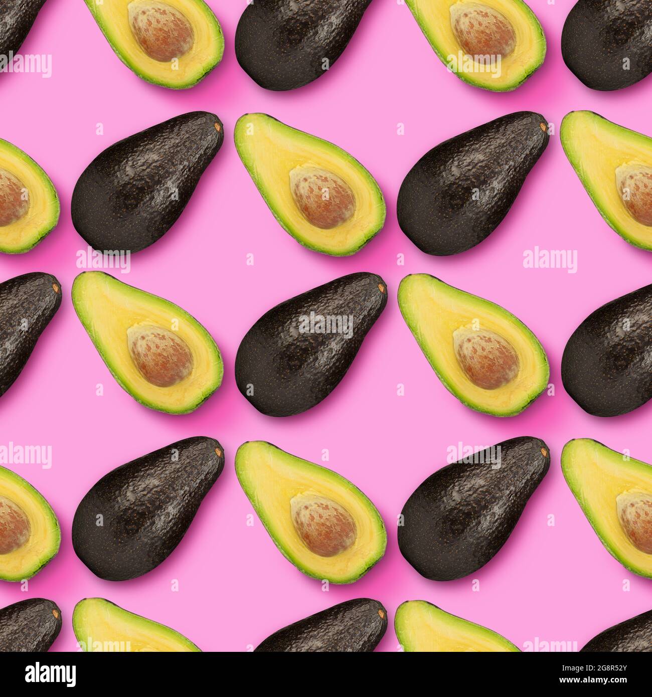 Halves and whole ripe avocado arranged in square over pink background ...