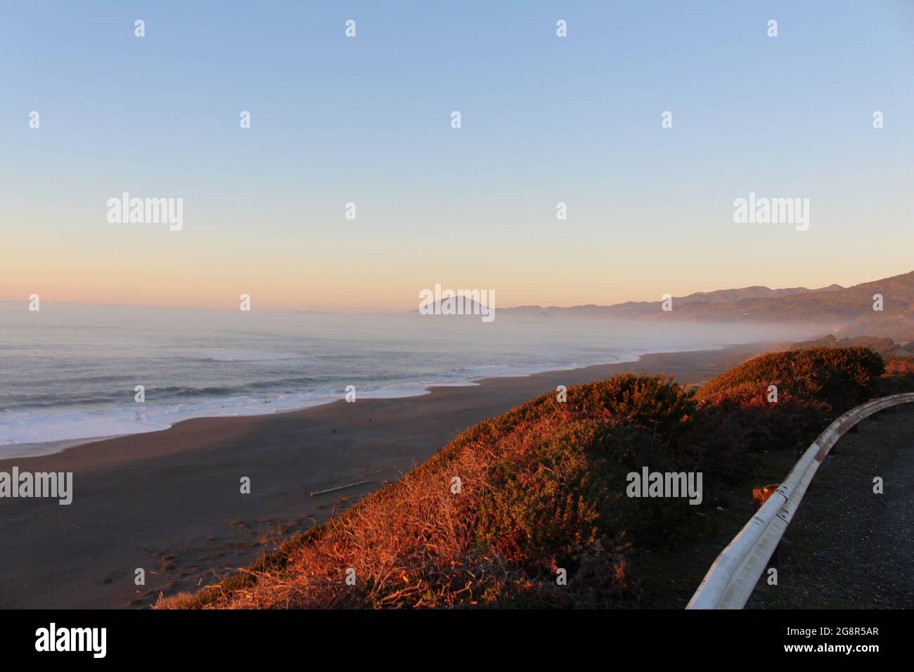 Beach in the red evening sun Stock Photo - Alamy
