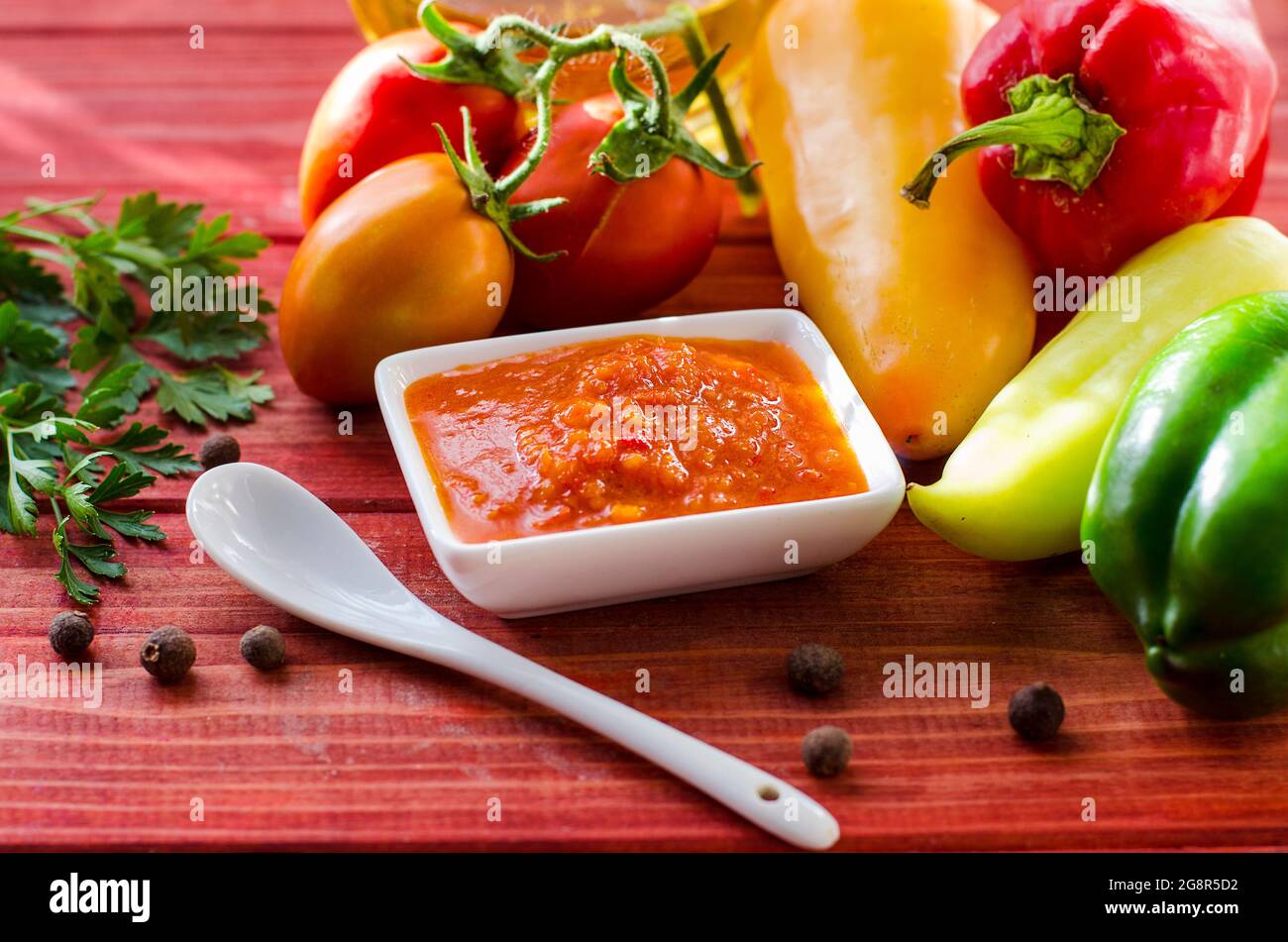 hot sauce adjika with fresh vegetables for cooking Stock Photo - Alamy