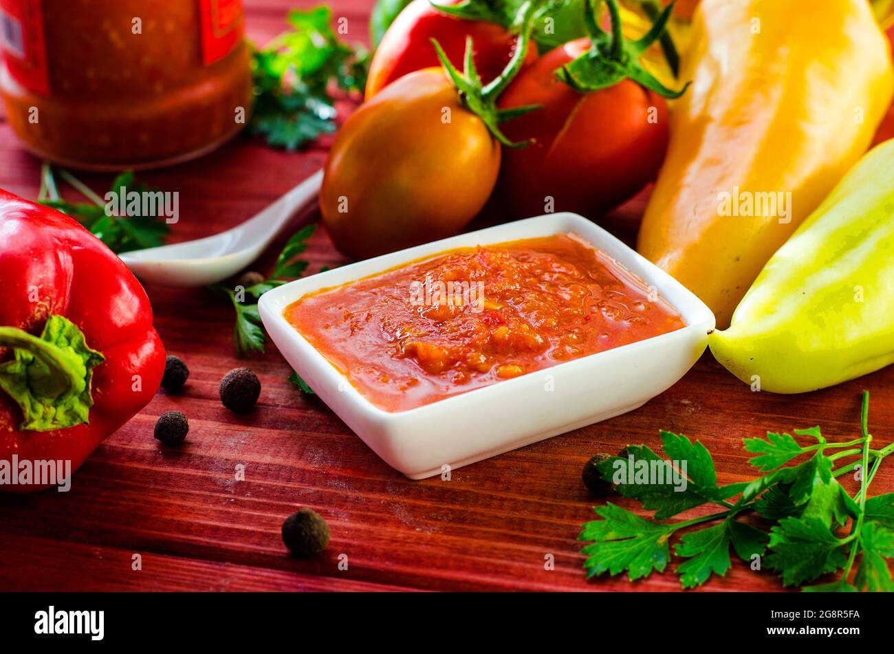 hot sauce adjika with fresh vegetables for cooking Stock Photo - Alamy