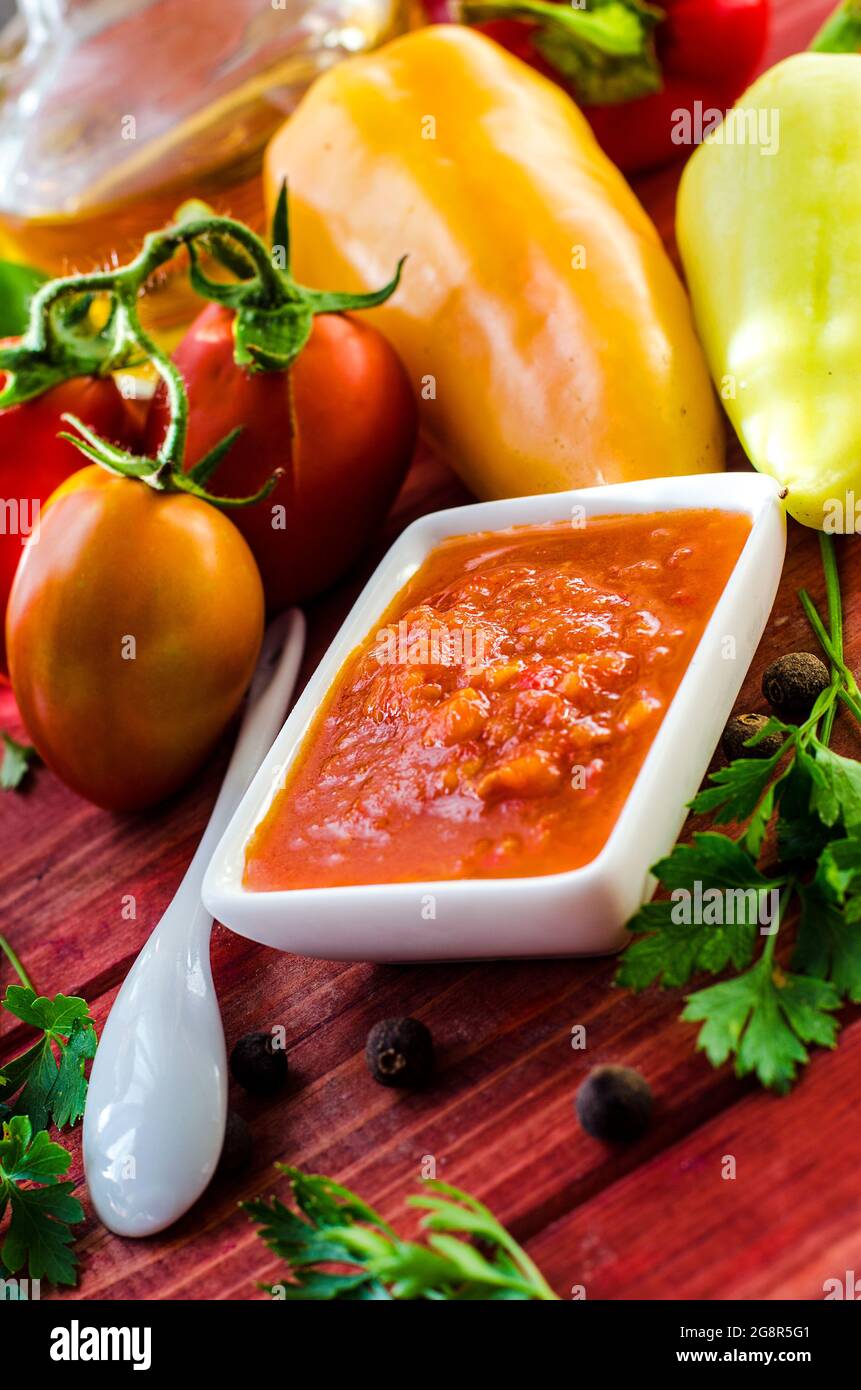 hot sauce adjika with fresh vegetables for cooking Stock Photo - Alamy