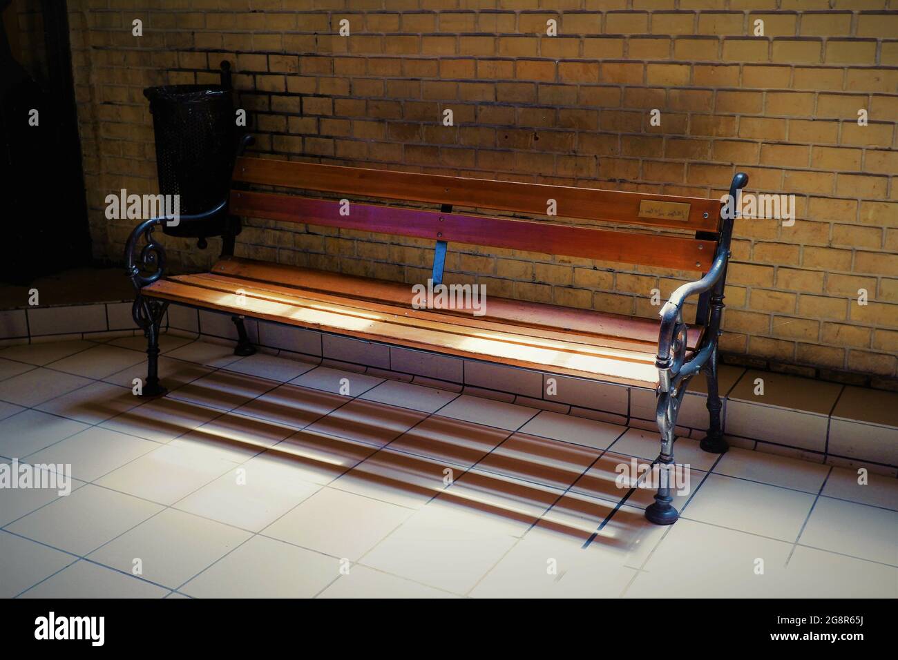 Wooden bench inside the building Stock Photo - Alamy