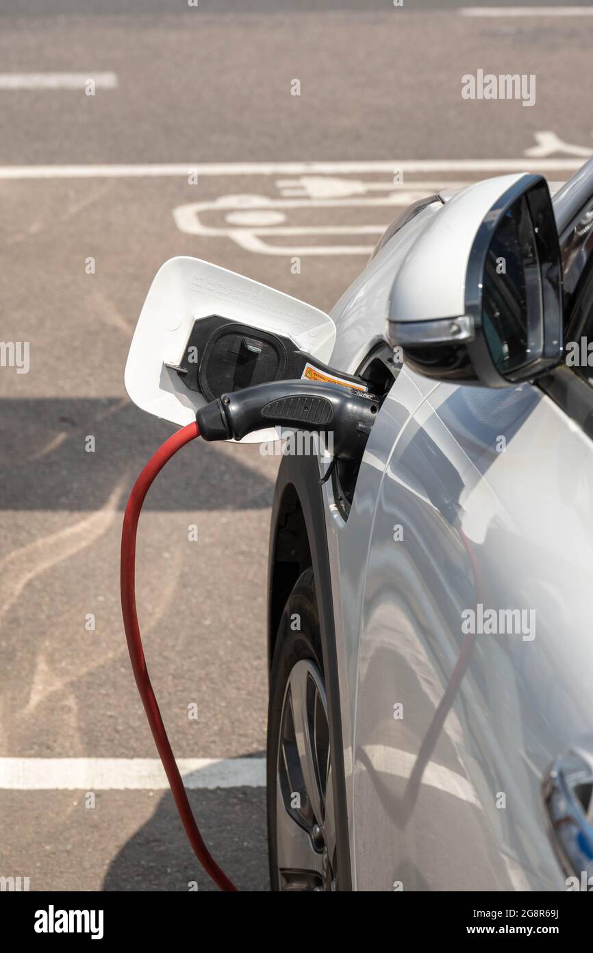 Electric vehicle being charged hi-res stock photography and images - Alamy