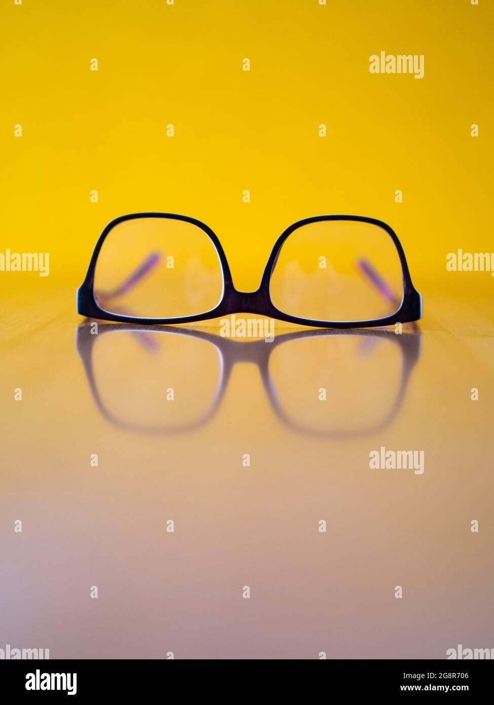 Nerdy eyeglasses for book covers Stock Photo - Alamy