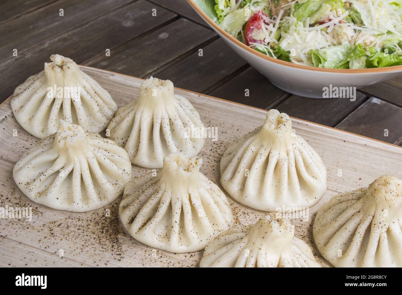 Georgian traditional food khinkali on the plate in a restaurant, ready ...