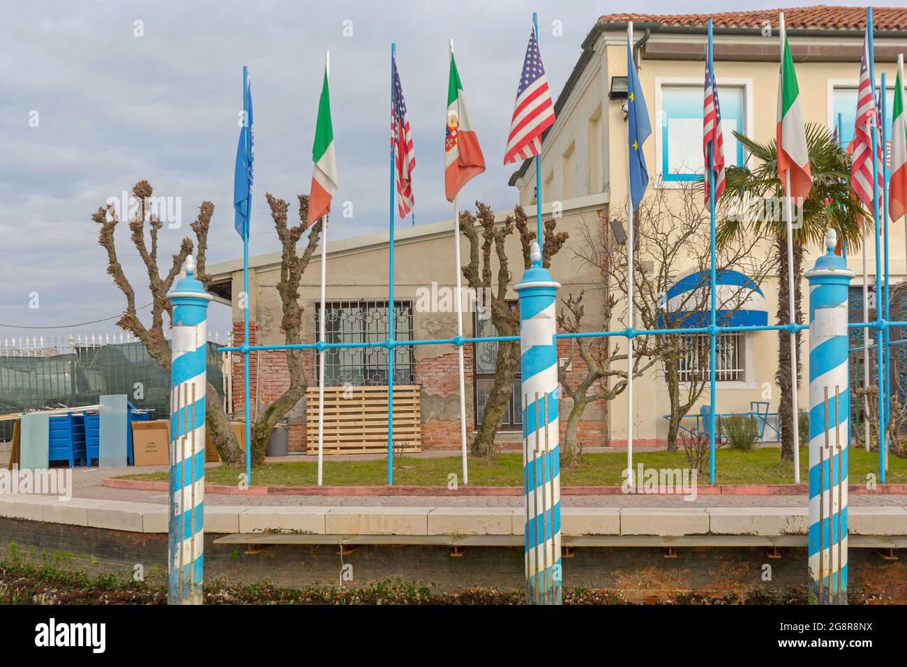 Usa Italy EU Flag Poles at Murano Island Stock Photo - Alamy