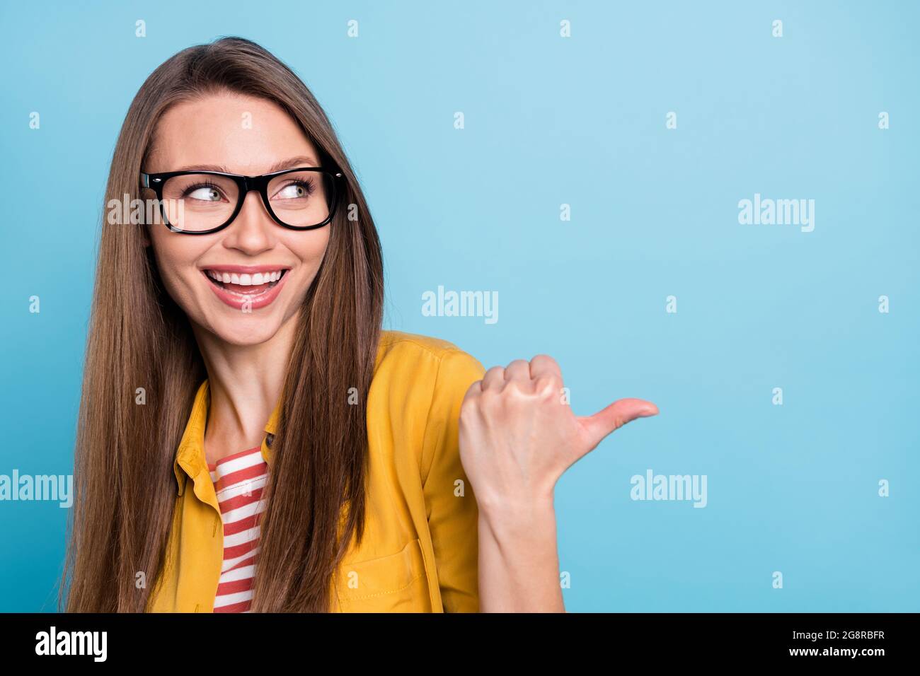 Photo of young pretty woman happy positive smile point thumb empty ...