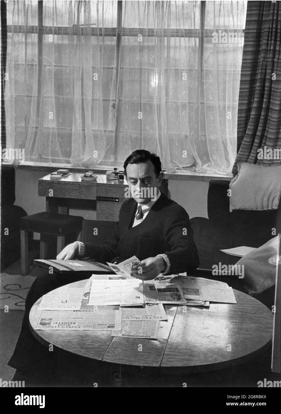 British Film Director DAVID LEAN candid portrait looking at Press ...