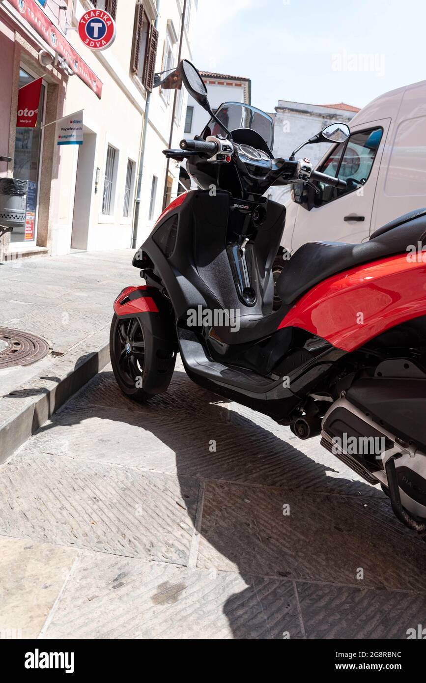 KOPER, SLOVENIA - JULY 12, 2021: Scooter in the city, cheap, ecological ...