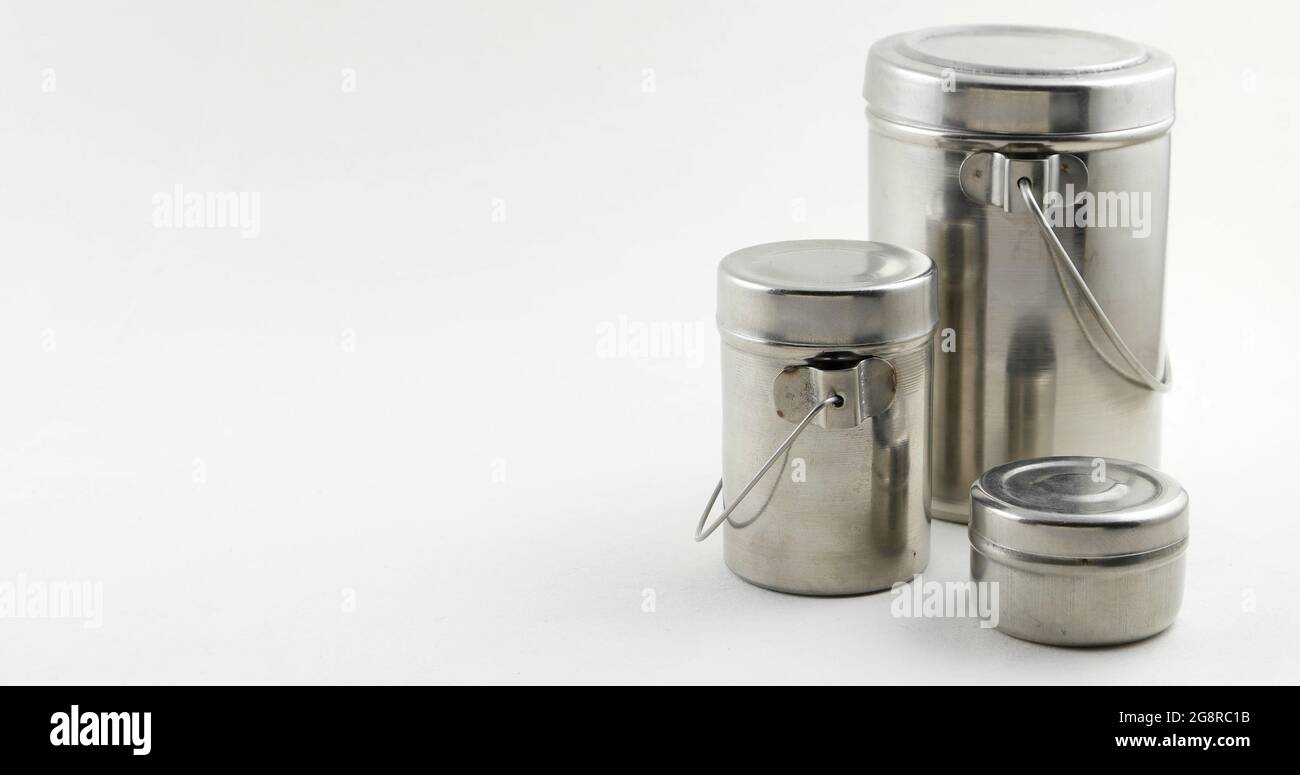 Closeup shot of tins of different sizes isolated on a white background ...