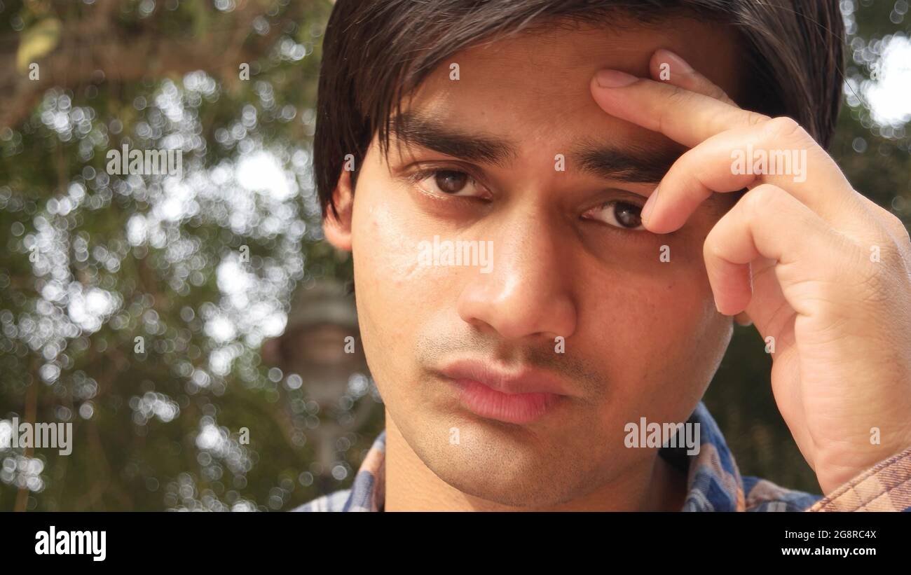 Portrait of a sad Indan man Stock Photo - Alamy
