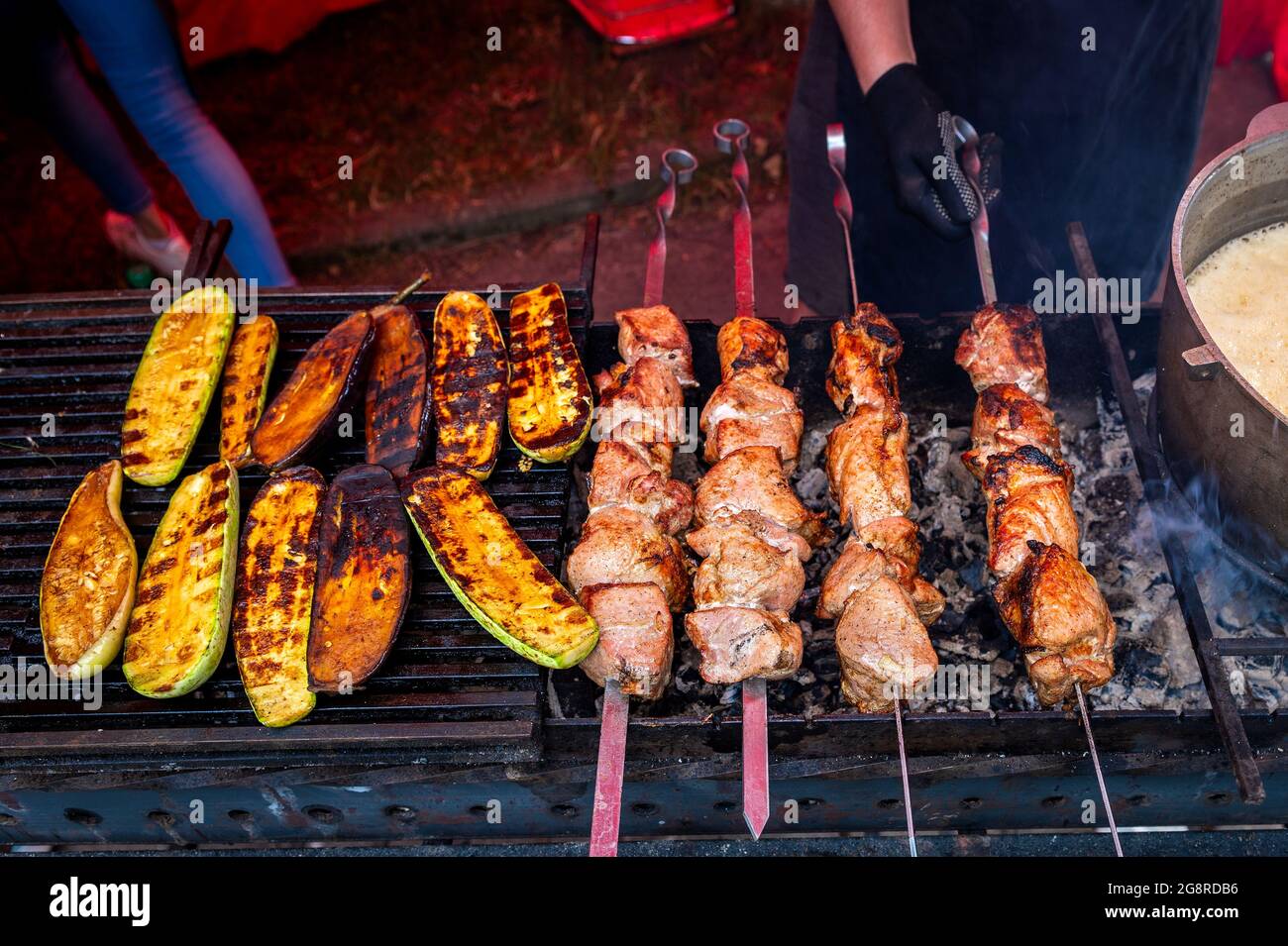 Grilled meat and vegetables. Grilling meat with the addition vegetables ...
