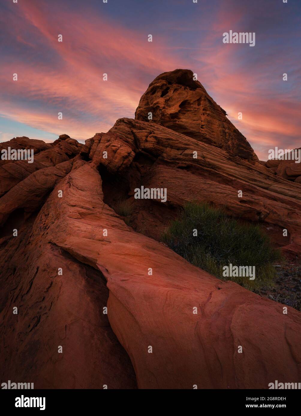 Vertical shot of a red cliff on a beautiful sunset sky background Stock ...