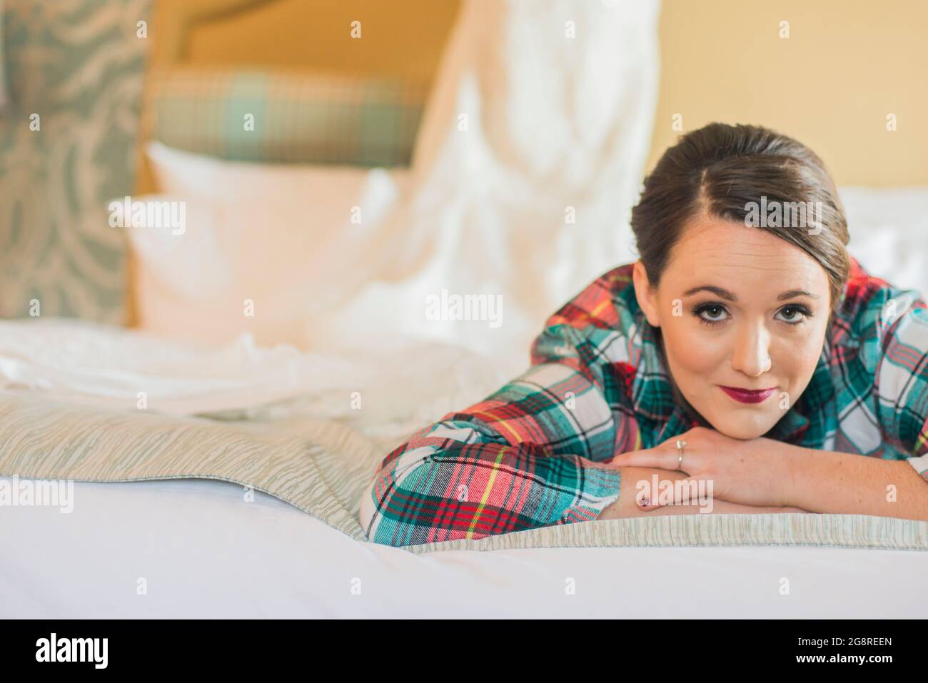 Bride relaxing before putting on wedding dress Stock Photo - Alamy