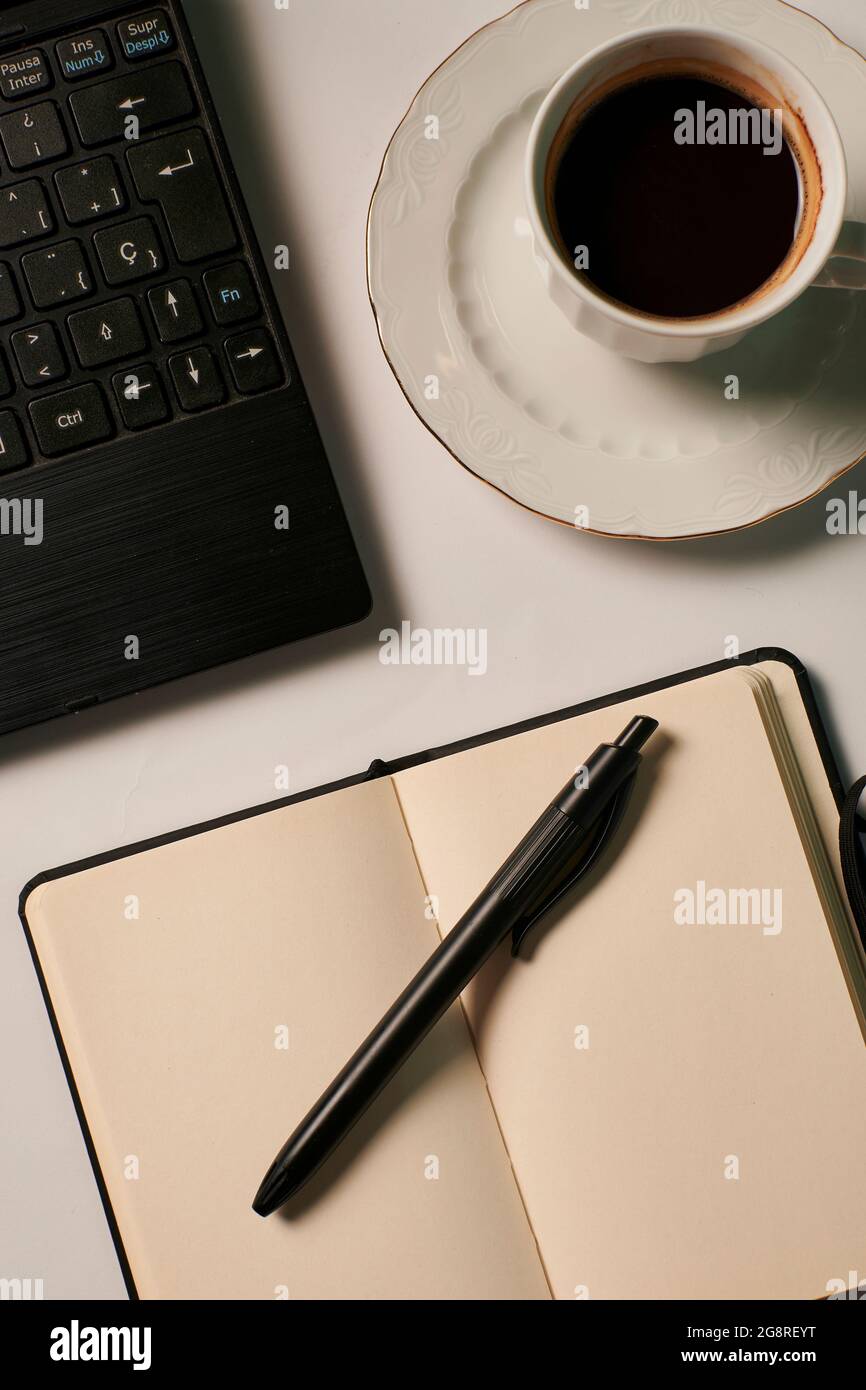 business still live concept with a notebook, coffee cup and laptop ...