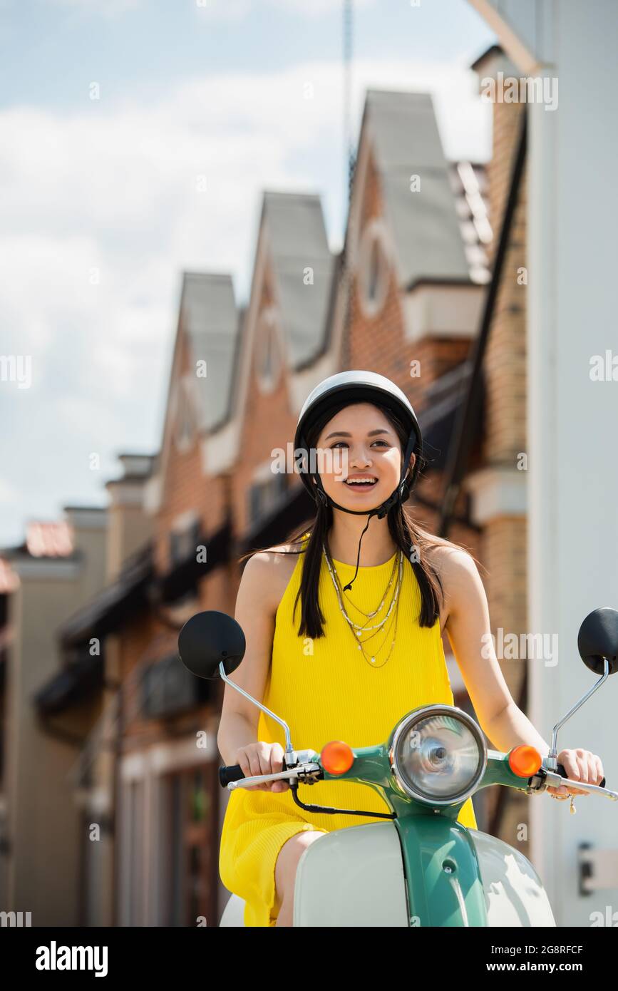 Young asian woman riding scooter hi-res stock photography and images ...