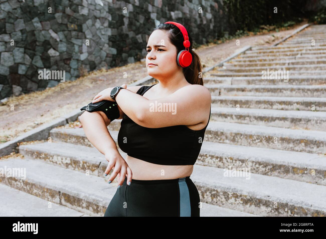 plus size young latin woman running in park in Mexico Stock Photo - Alamy