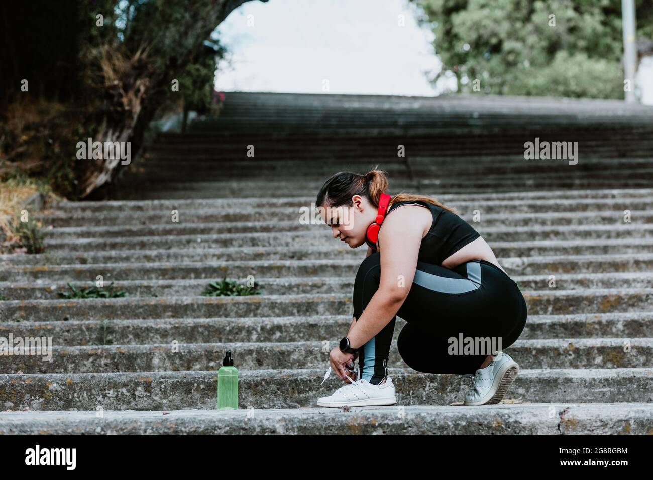 plus size young latin woman running in park in Mexico Stock Photo - Alamy