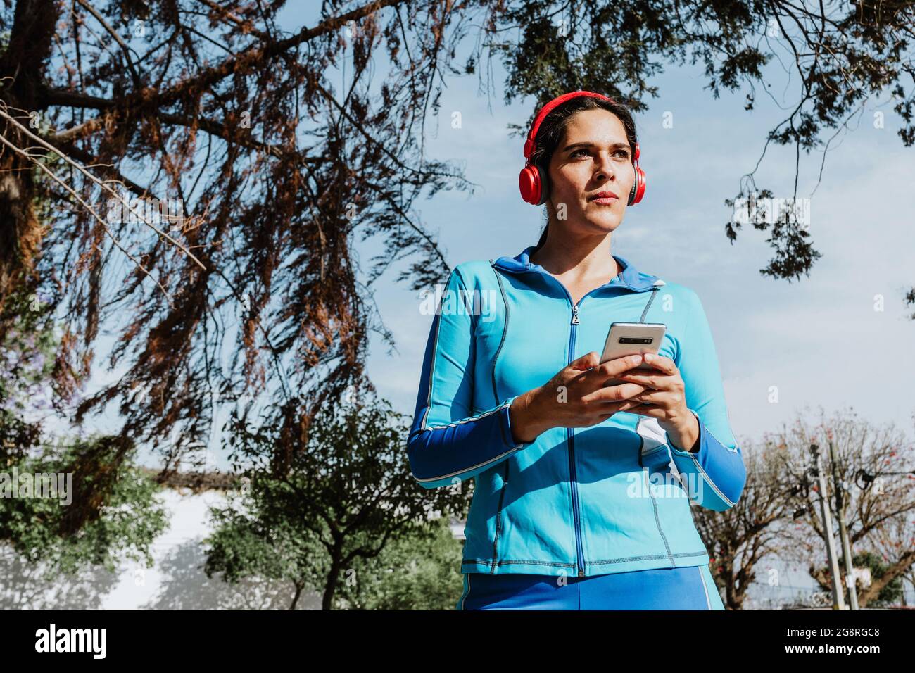 latin woman running in park in Mexico Stock Photo - Alamy