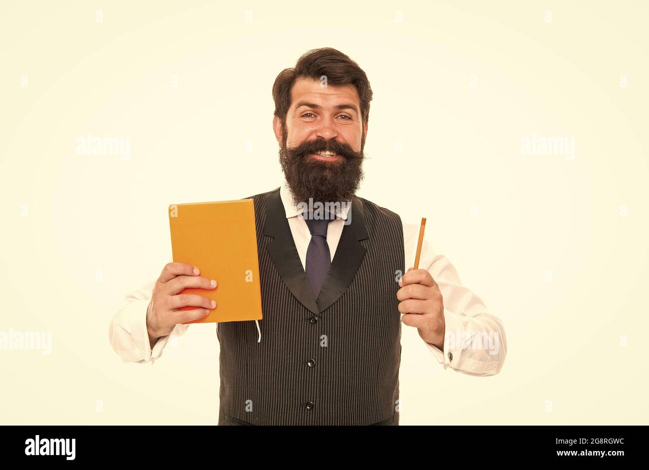 Happy school teacher hold book and pen for teaching reading and writing ...