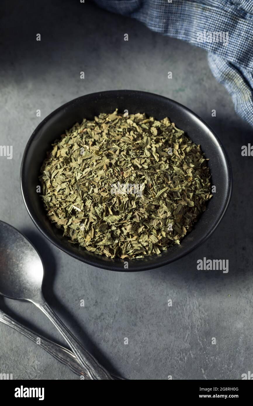 Healthy Organic Dried Basil Spice in a Bowl Stock Photo - Alamy