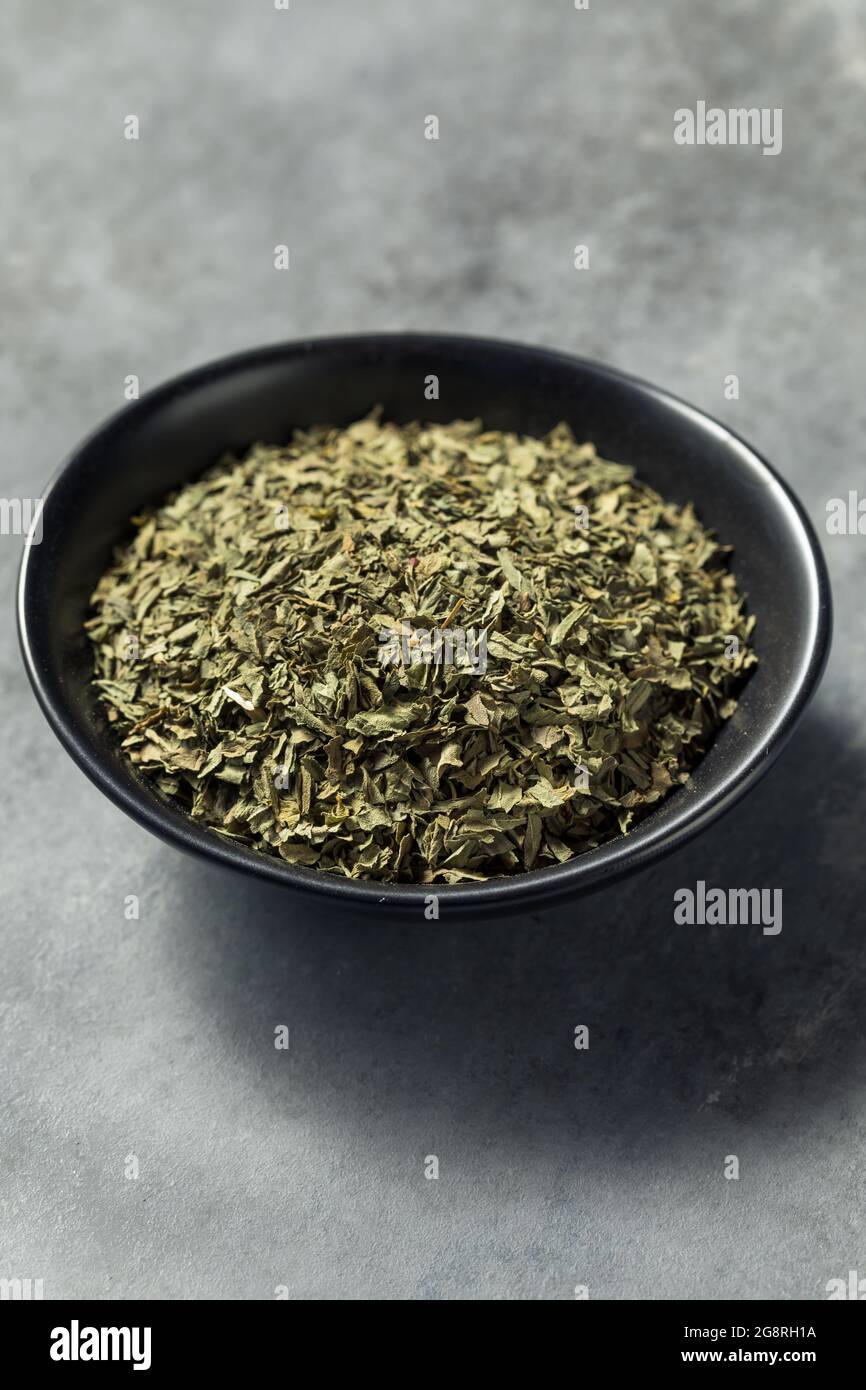 Healthy Organic Dried Basil Spice in a Bowl Stock Photo - Alamy