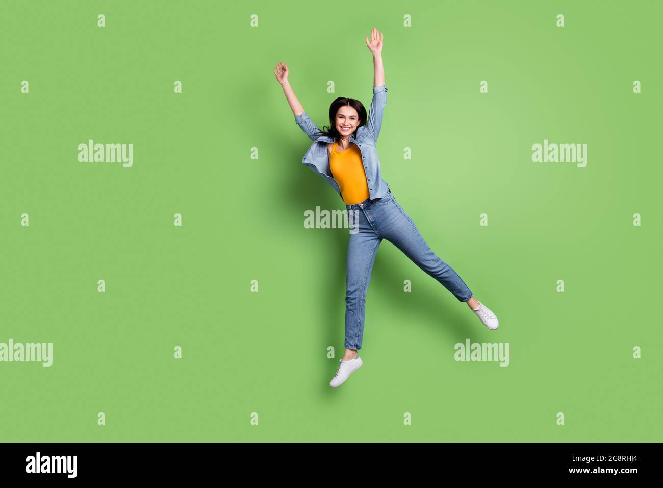 Full body photo of funky pretty brown hairdo lady jump wear jeans shirt ...