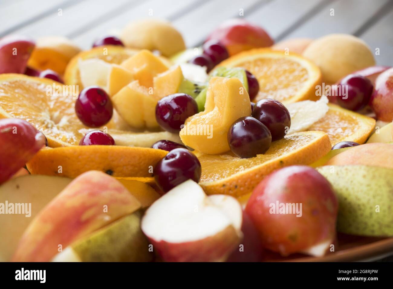 Juicy fruit assortment, appetizer with various fruits on the plate ...