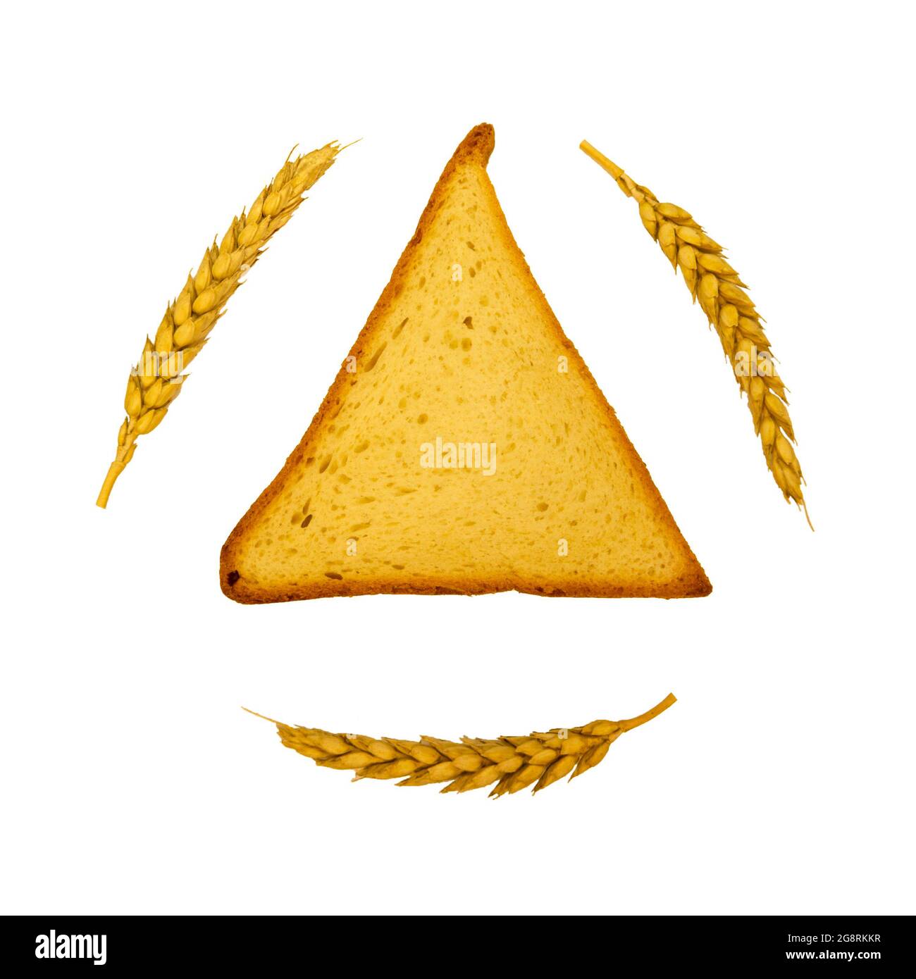 Triangular piece of bread for a sandwich with spikelets of wheat ...