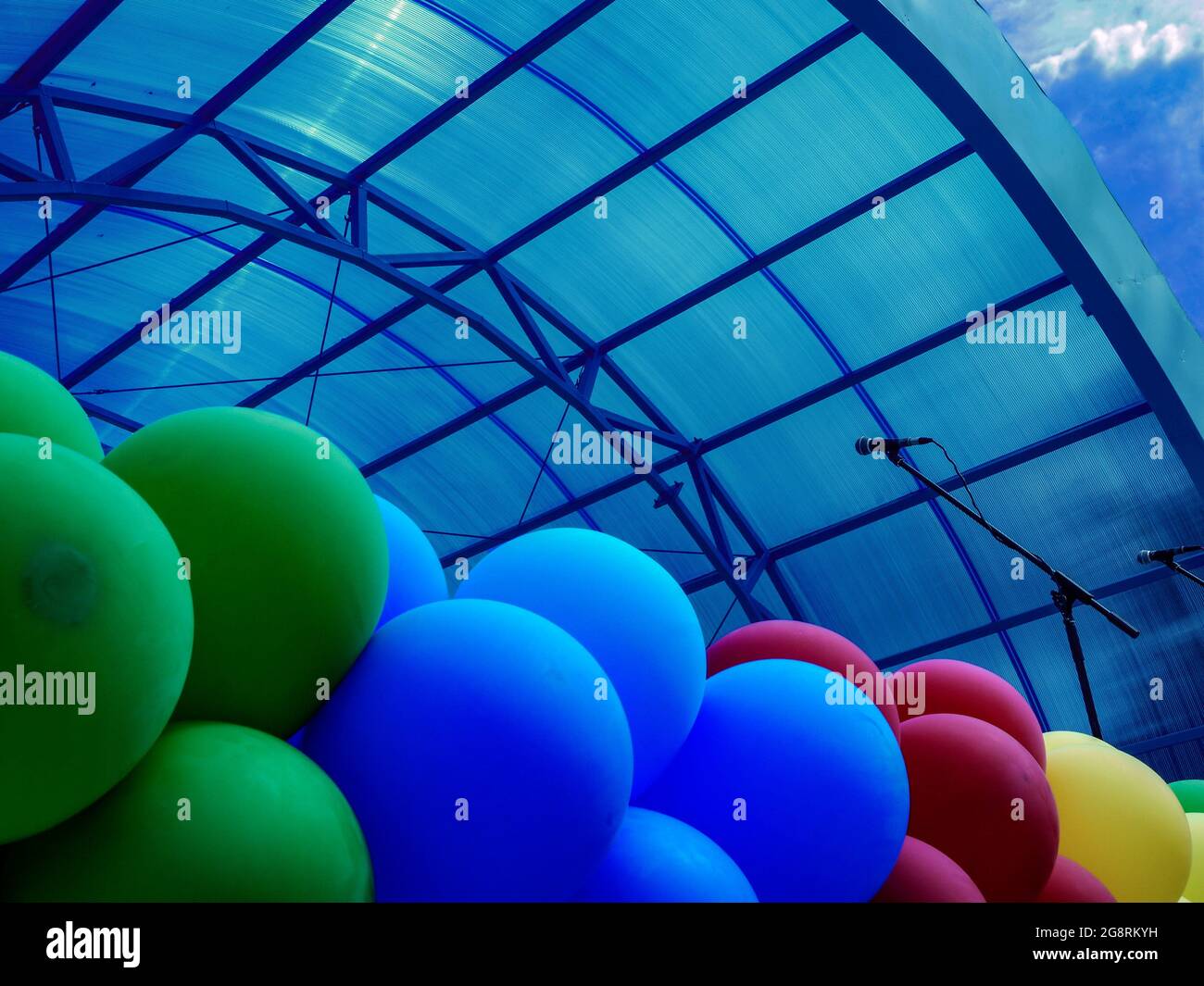 Open-air concert on a stage decorated with balloons. Open-air music ...