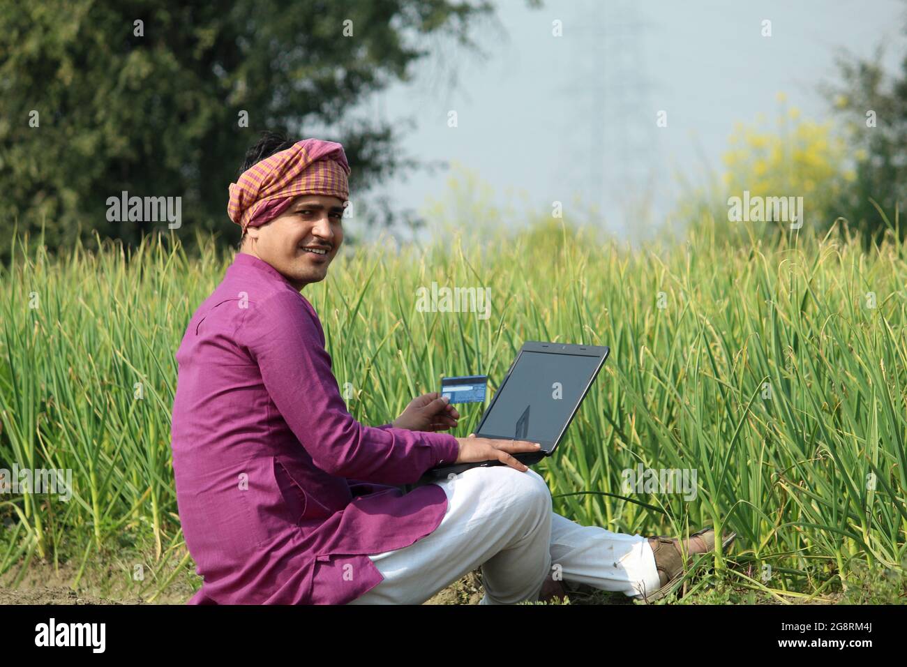 farmer,indian farmer,using laptop in agricultural field Stock Photo - Alamy
