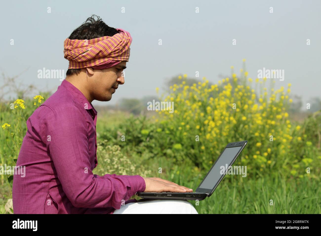 farmer,indian farmer,using laptop in agricultural field Stock Photo - Alamy