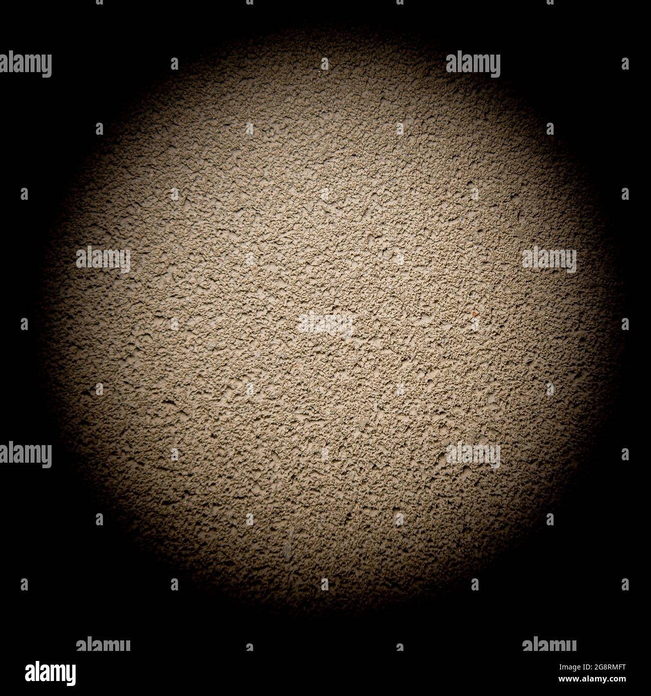 Background looks like a round fragment of rough wall surface after ...