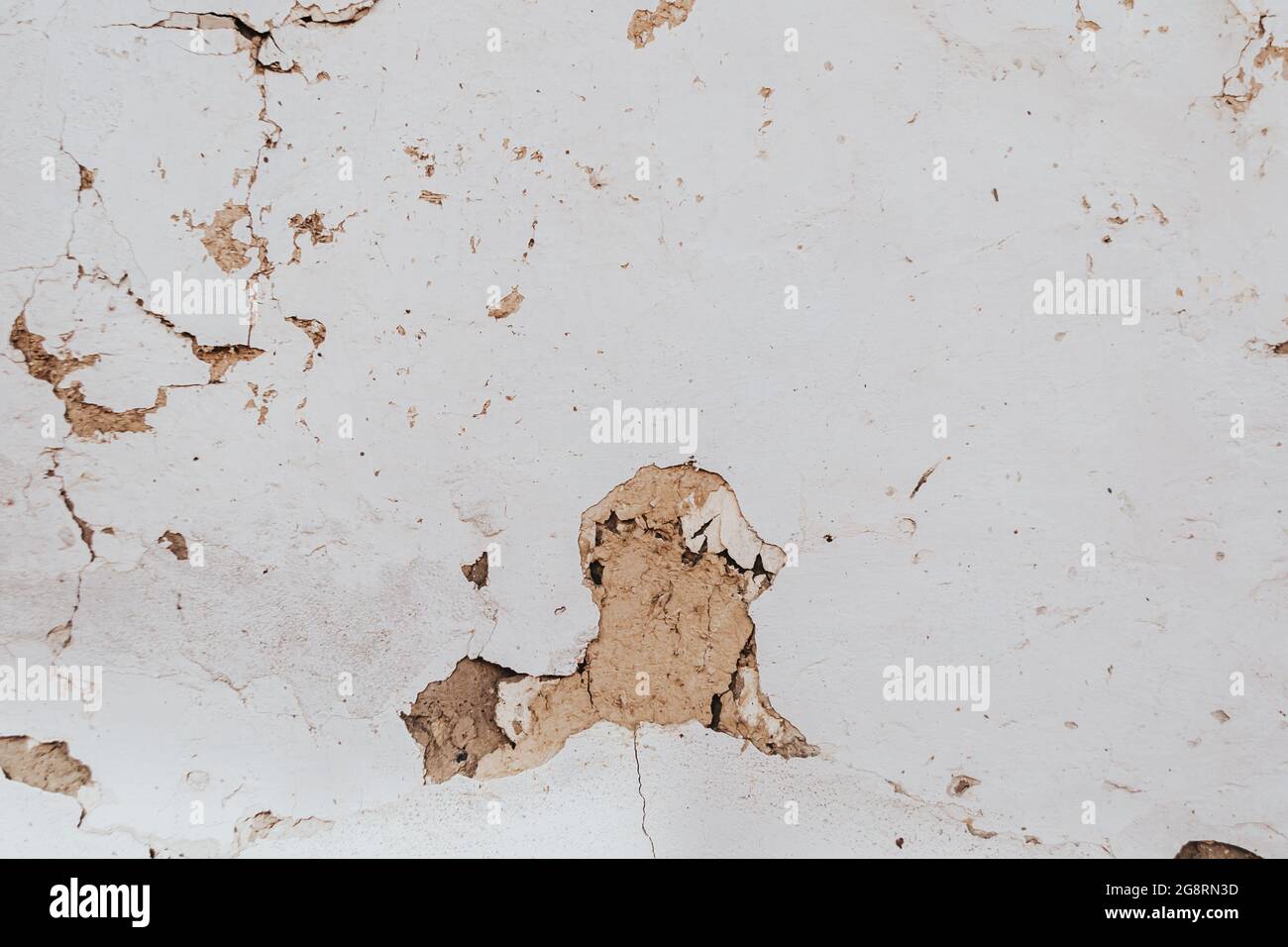 Closeup shot of a weathered white wall surface with cracks Stock Photo ...
