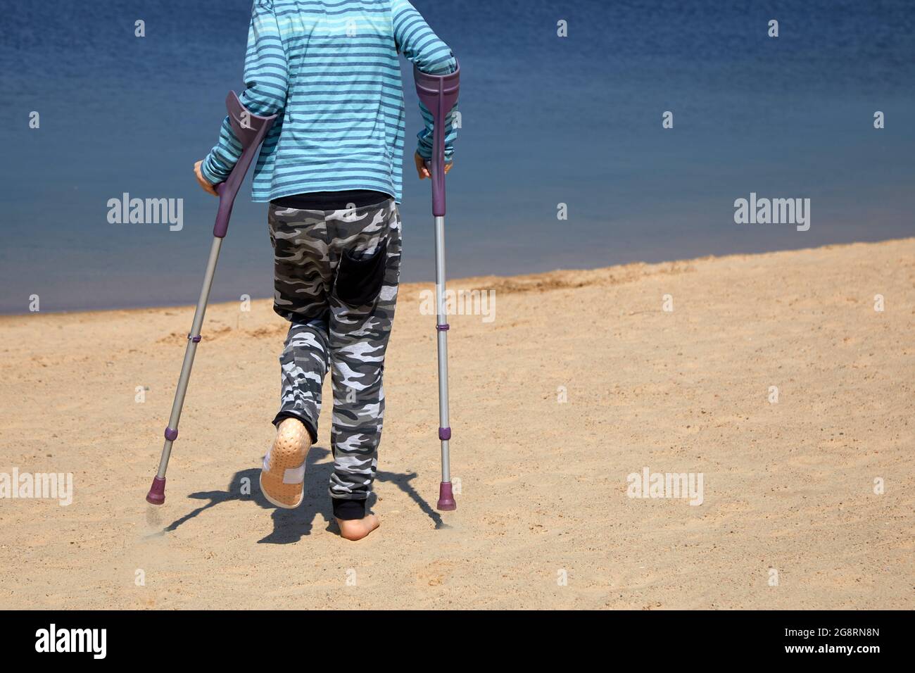 Boy Crutches High Resolution Stock Photography and Images - Alamy