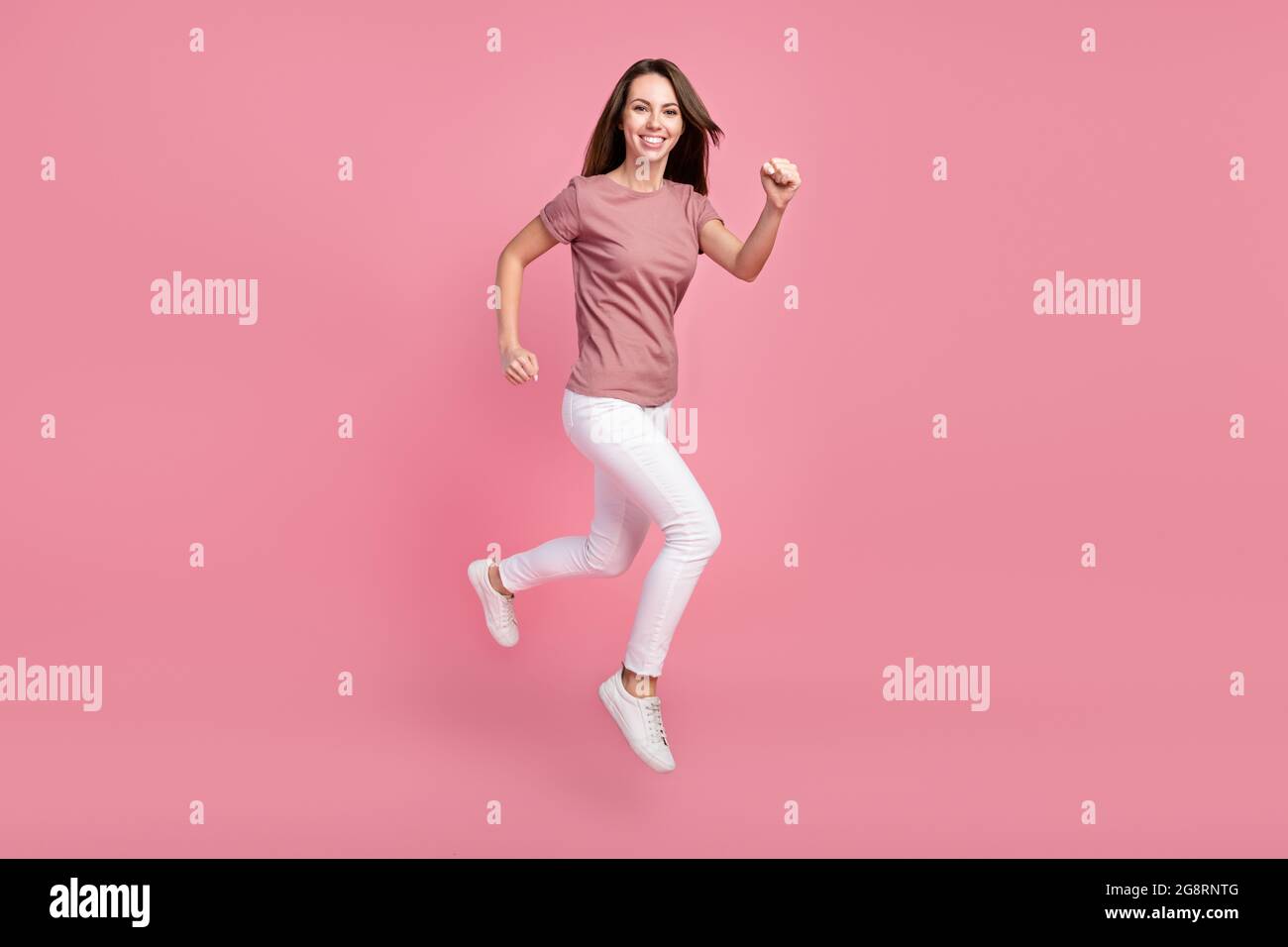 Full length body size view of attractive cheerful girl jumping running ...
