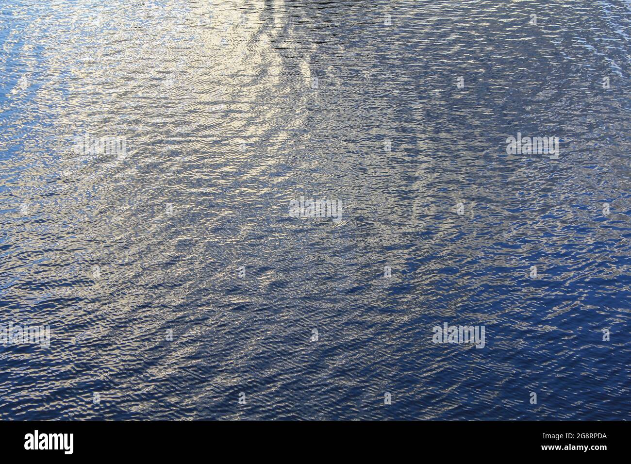 Background in the form of a calm water surface. View from a height of ...