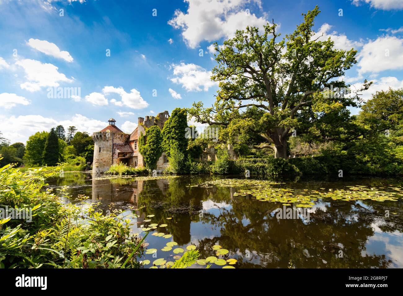 The 14th Century moated castle of Scotney castle in Kent Stock Photo ...
