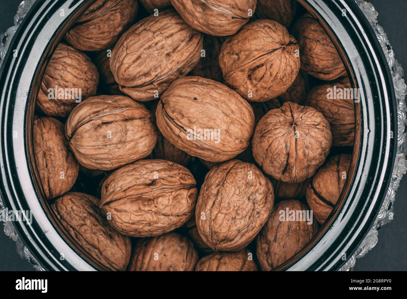 Top view of walnuts in a jar Stock Photo - Alamy