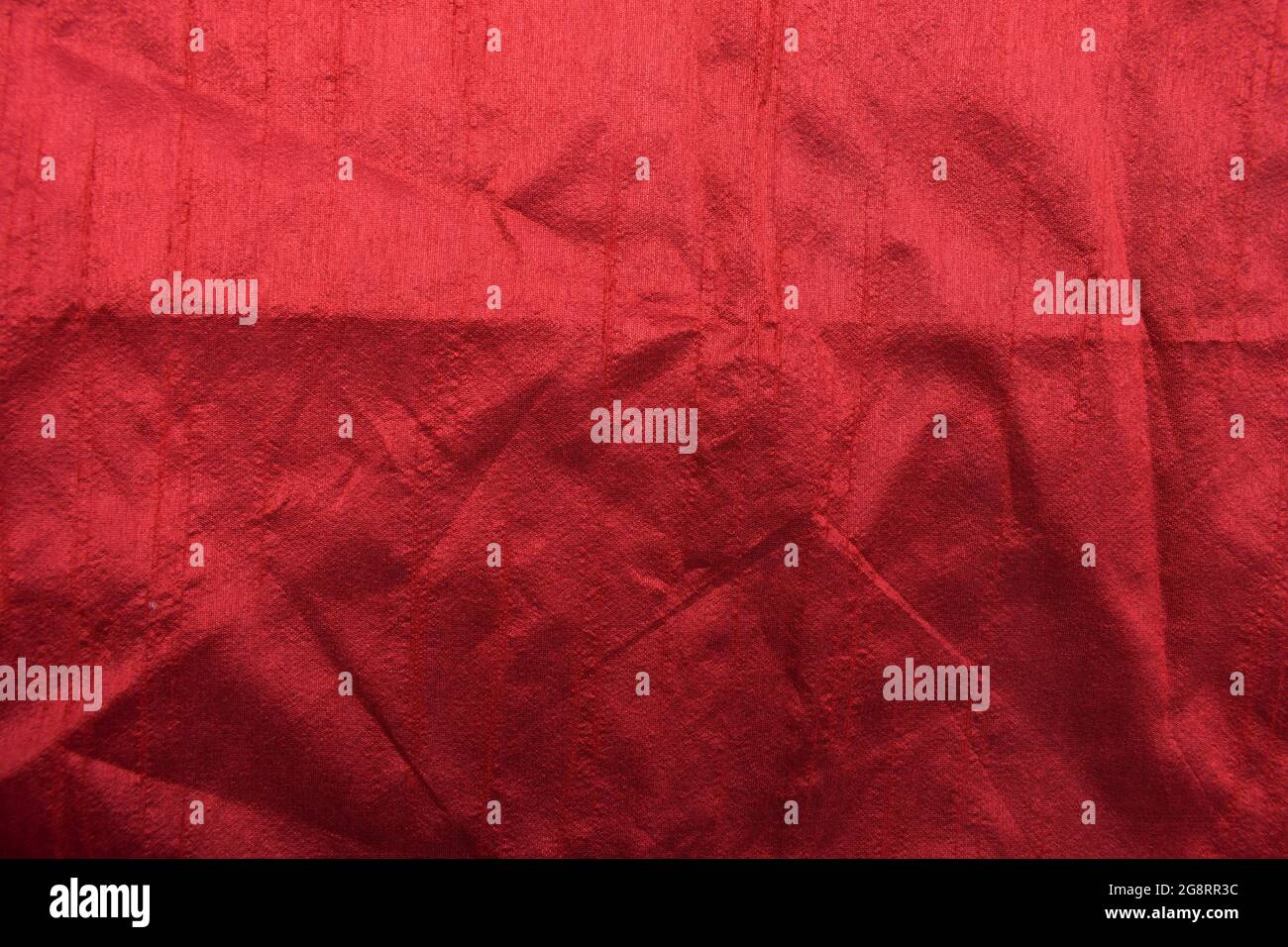Bright red fabric clothing . Red textile silky shining cloth texture ...