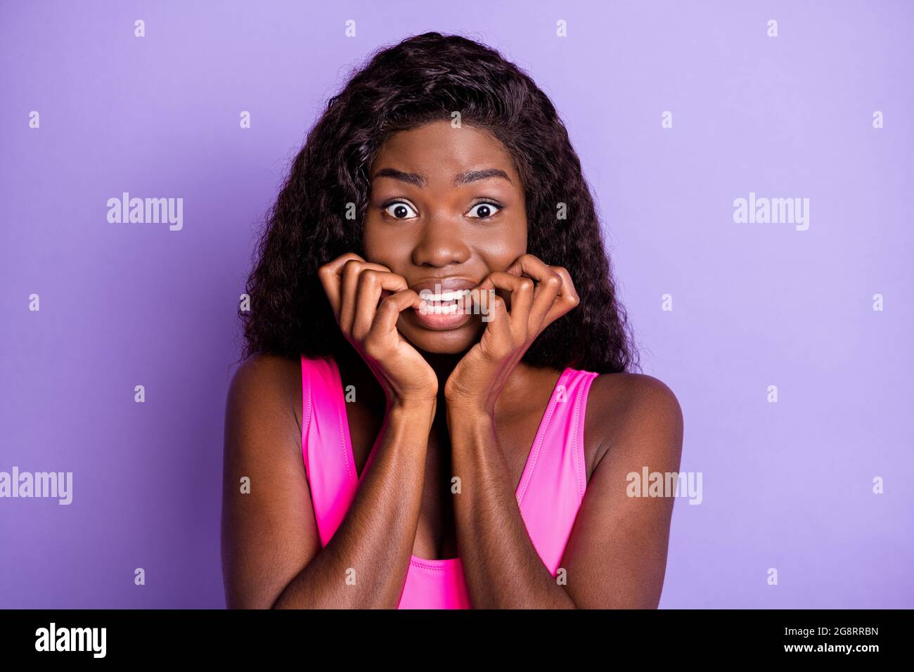 Photo of young black woman afraid scared bite fingers nervous panic ...